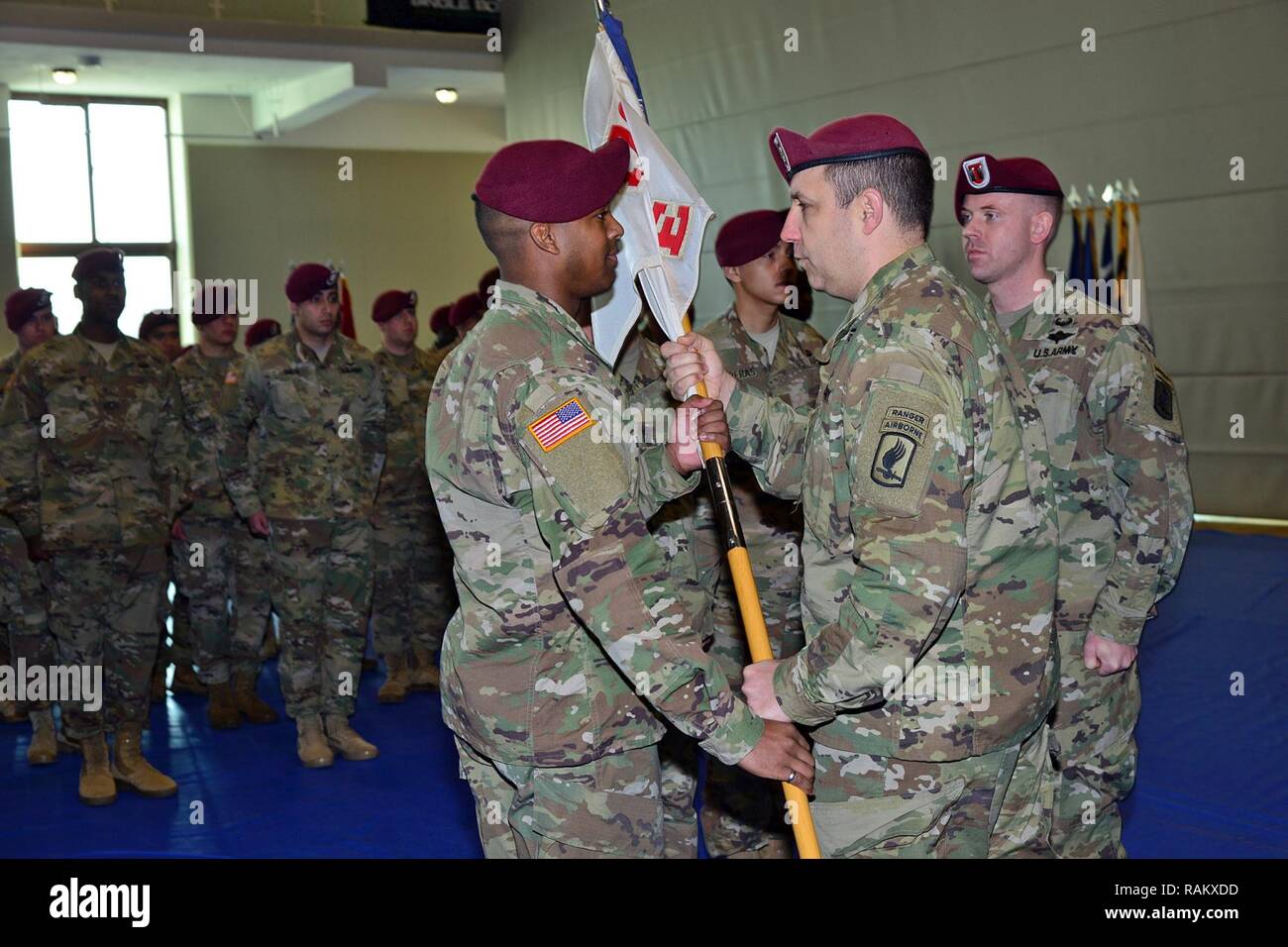 Capt. Ryan R. Fisher, Echo Company Commander, left, receives the guidon ...