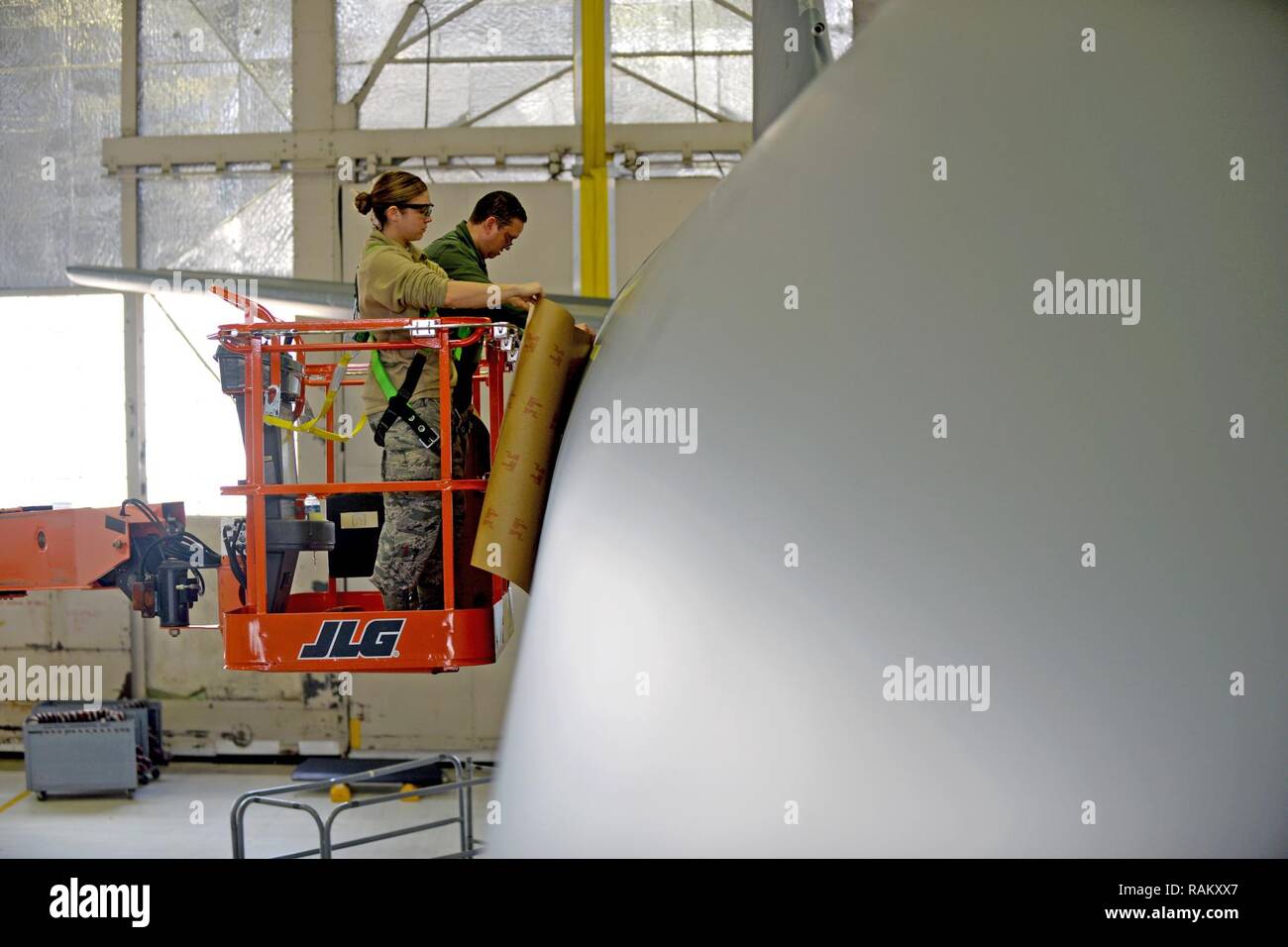 Airmen of the 121st Air Refueling Wing perform maintenance tasks on a ...