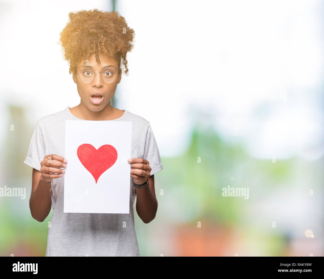 Worried woman holding paper heart hi-res stock photography and images ...