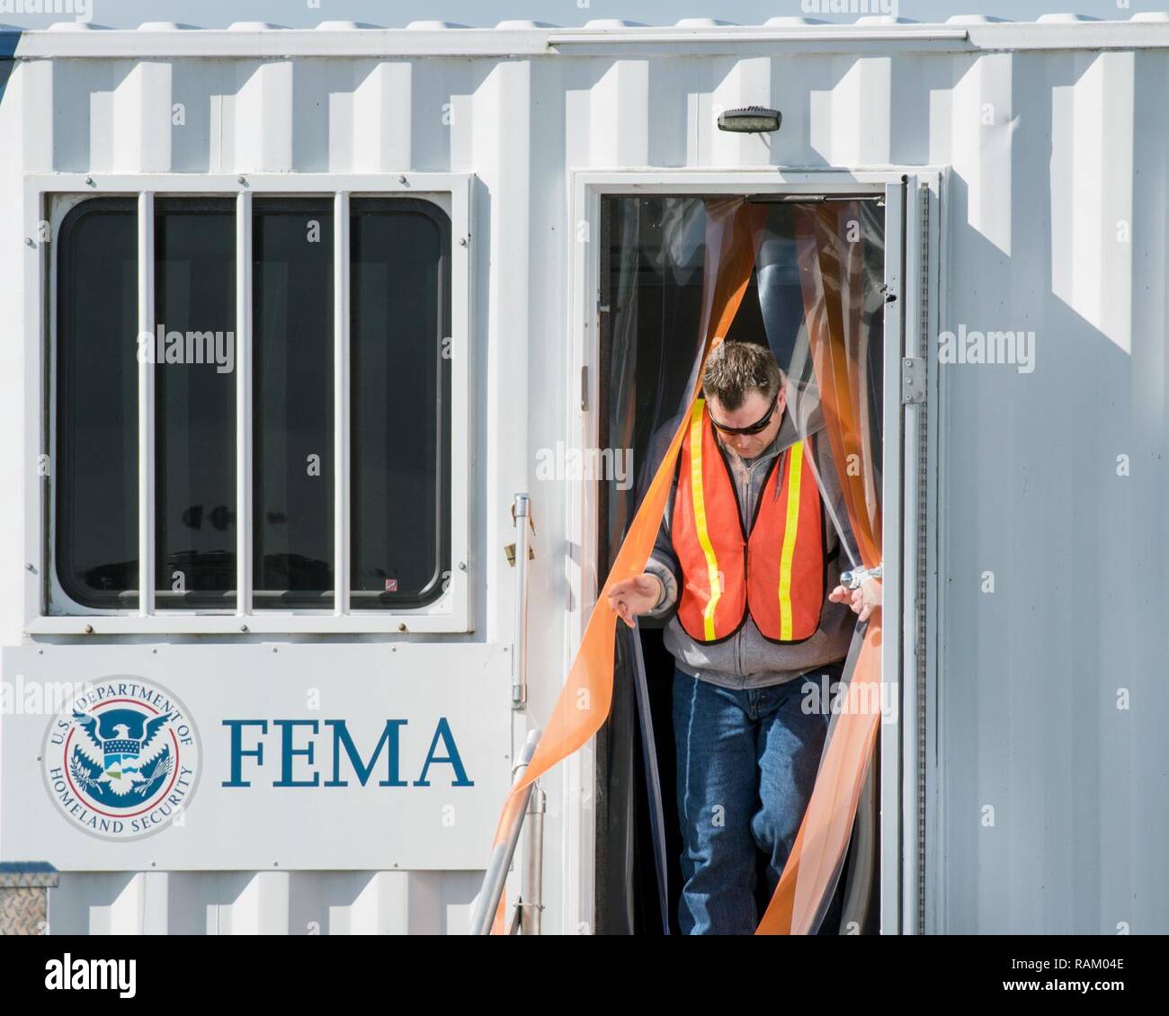 A Federal Emergency Management Agency (FEMA) representative exits the ...