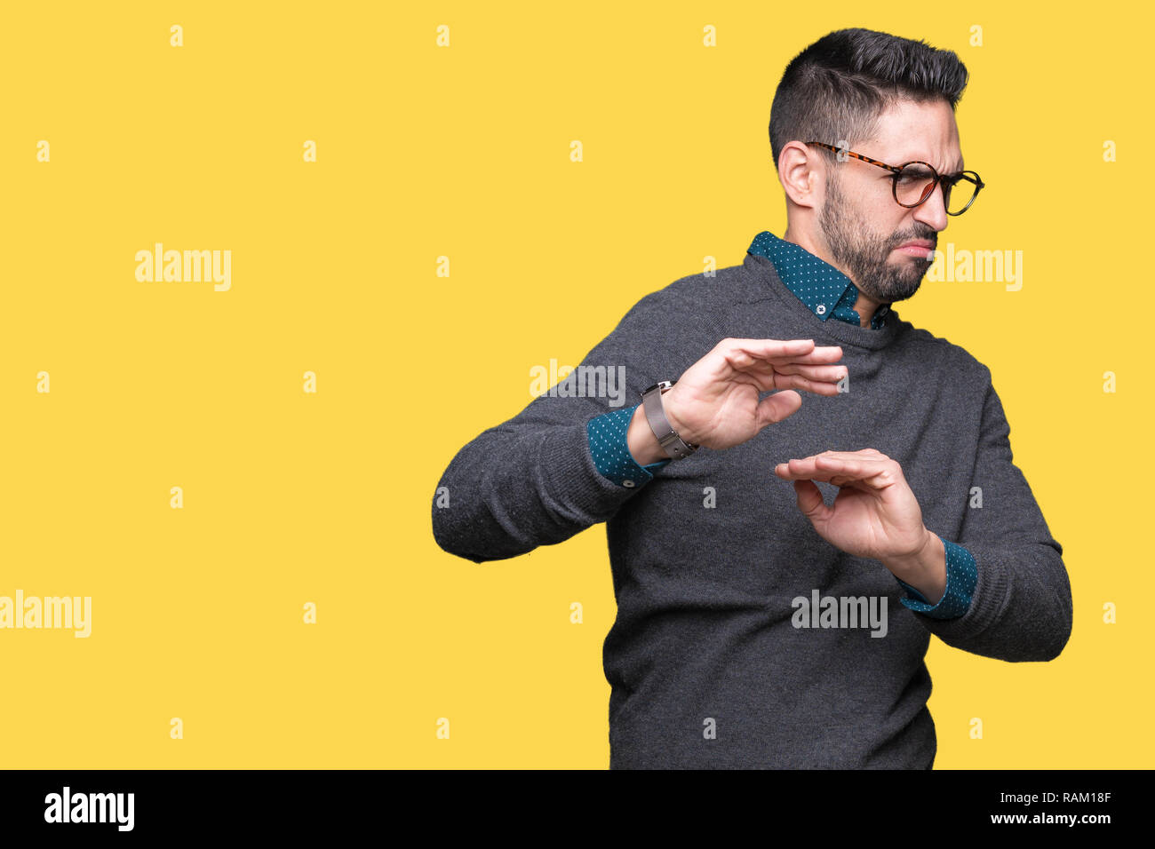 Young handsome man wearing glasses over isolated background disgusted ...