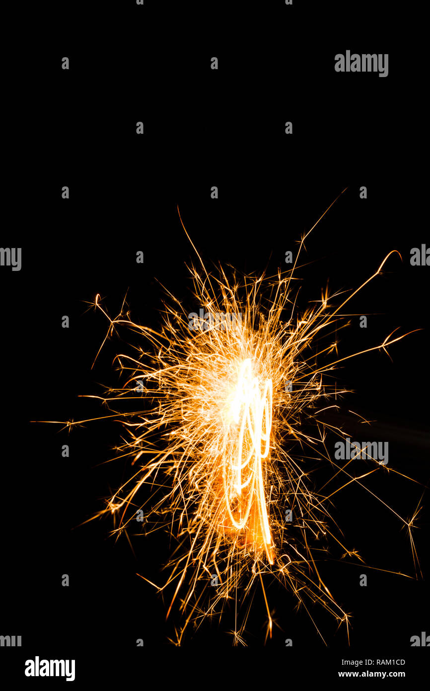 Bright sparkling sparkler on christmas hi-res stock photography and ...