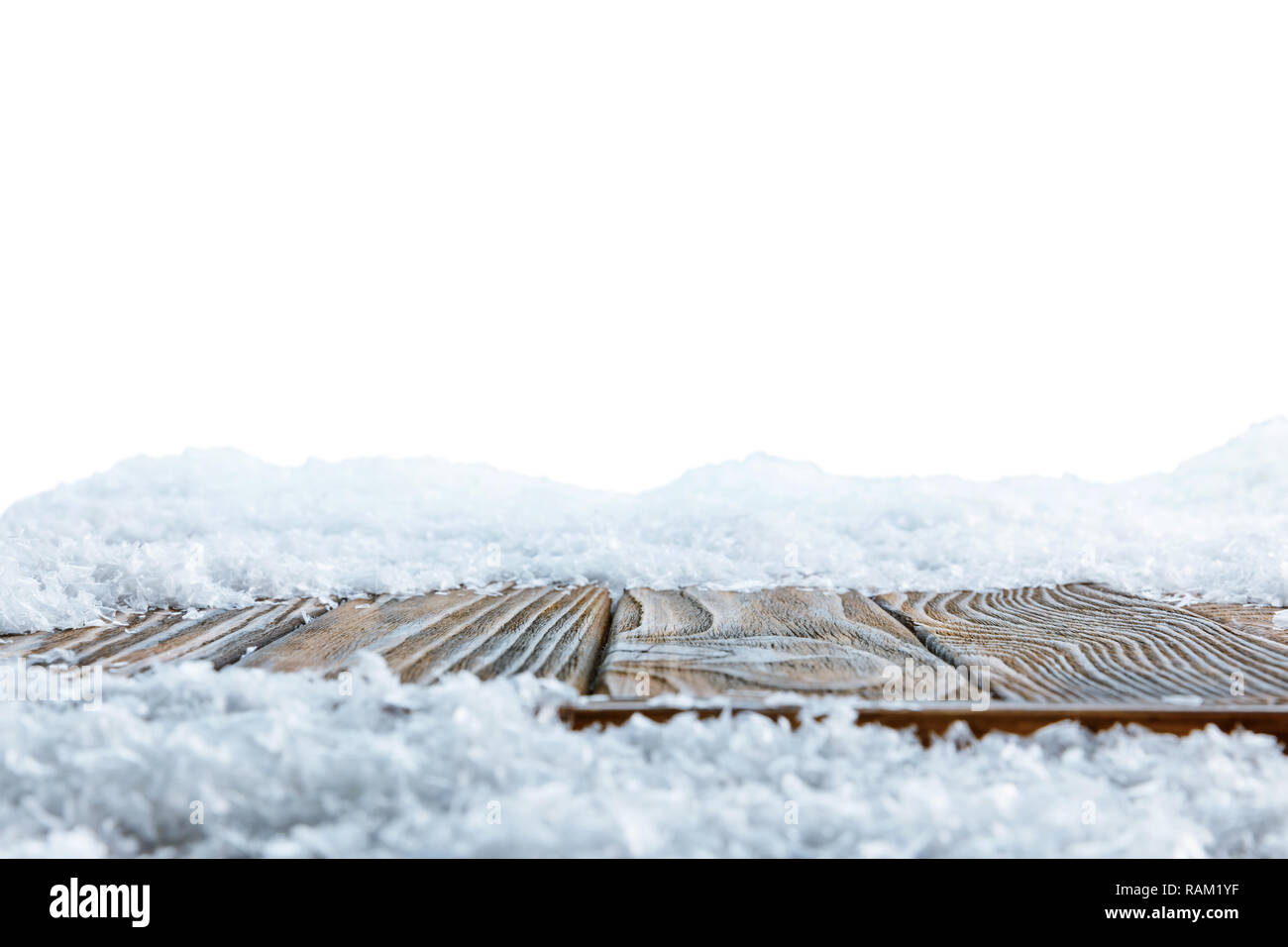 striped brown wooden board covered with snow on white Stock Photo - Alamy