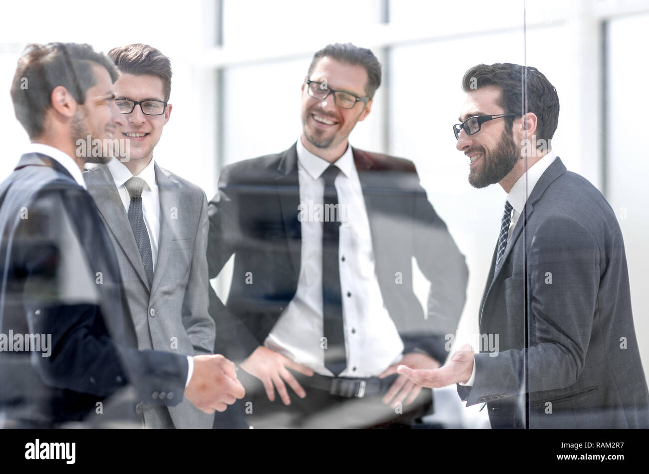 Diverse group business partners talking hi-res stock photography and ...