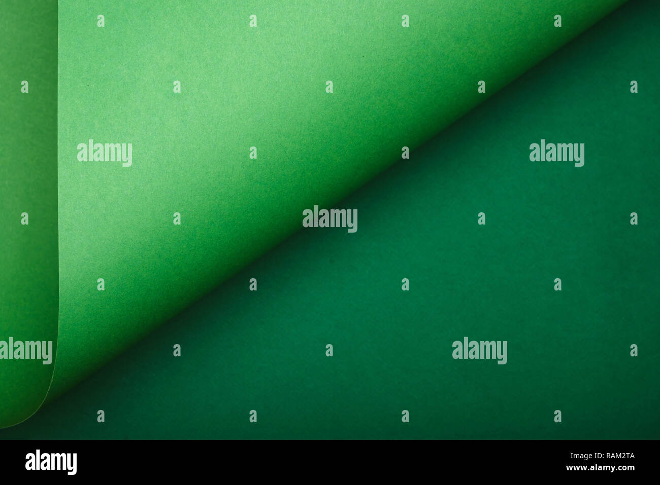 top view of green paper on colored background Stock Photo - Alamy
