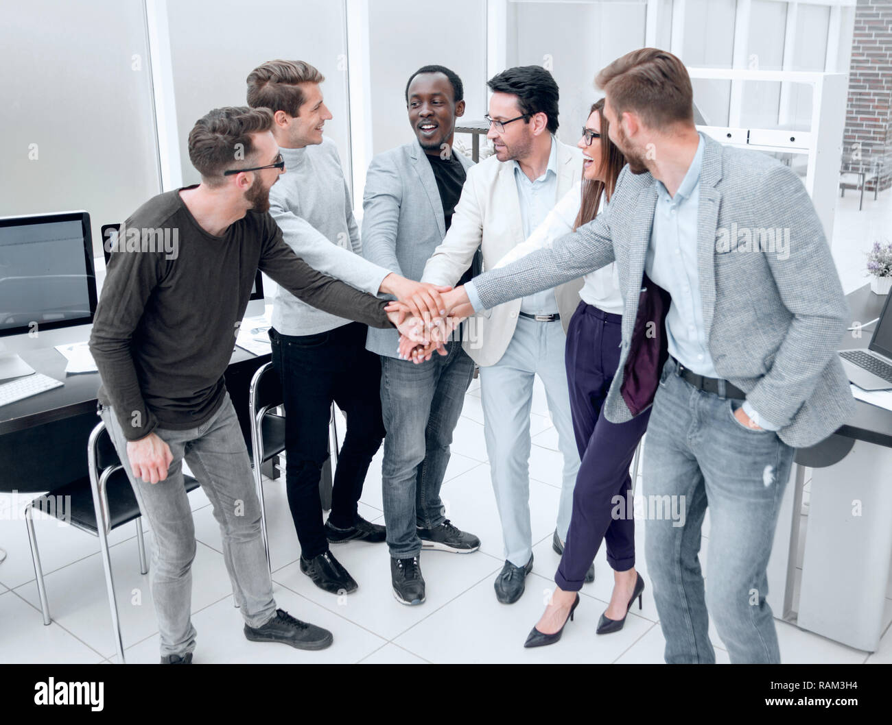 successful business team showing their unity Stock Photo - Alamy