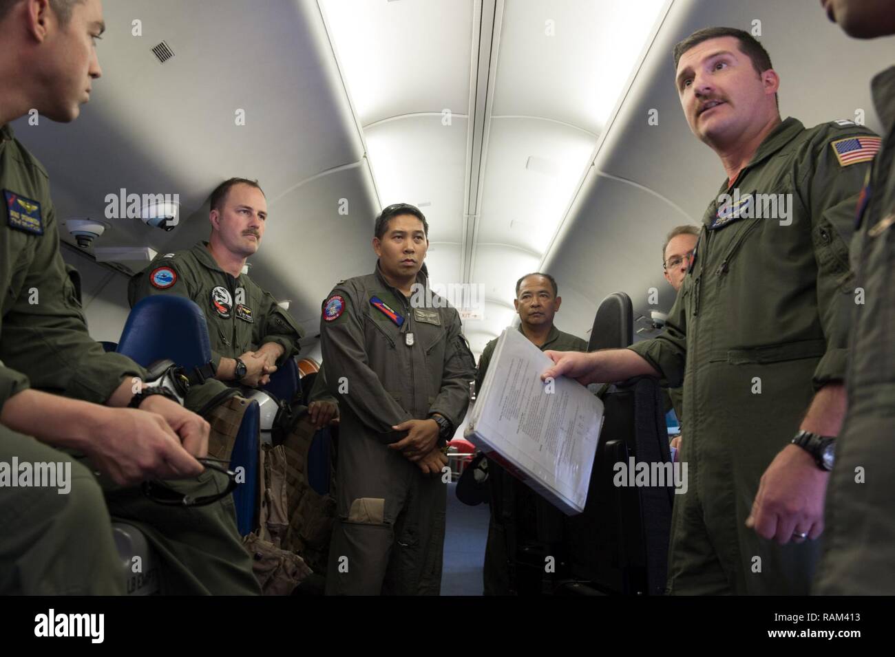 U.S. Navy Lt. Chad Fox, Patrol Squadron 10, briefs U.S. and Royal Thai ...
