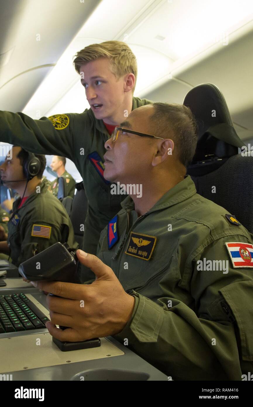 U.S. Navy Aviation Warfare Systems Operator 3rd Class Chase Moyer, Patrol Squadron 10 (left ...
