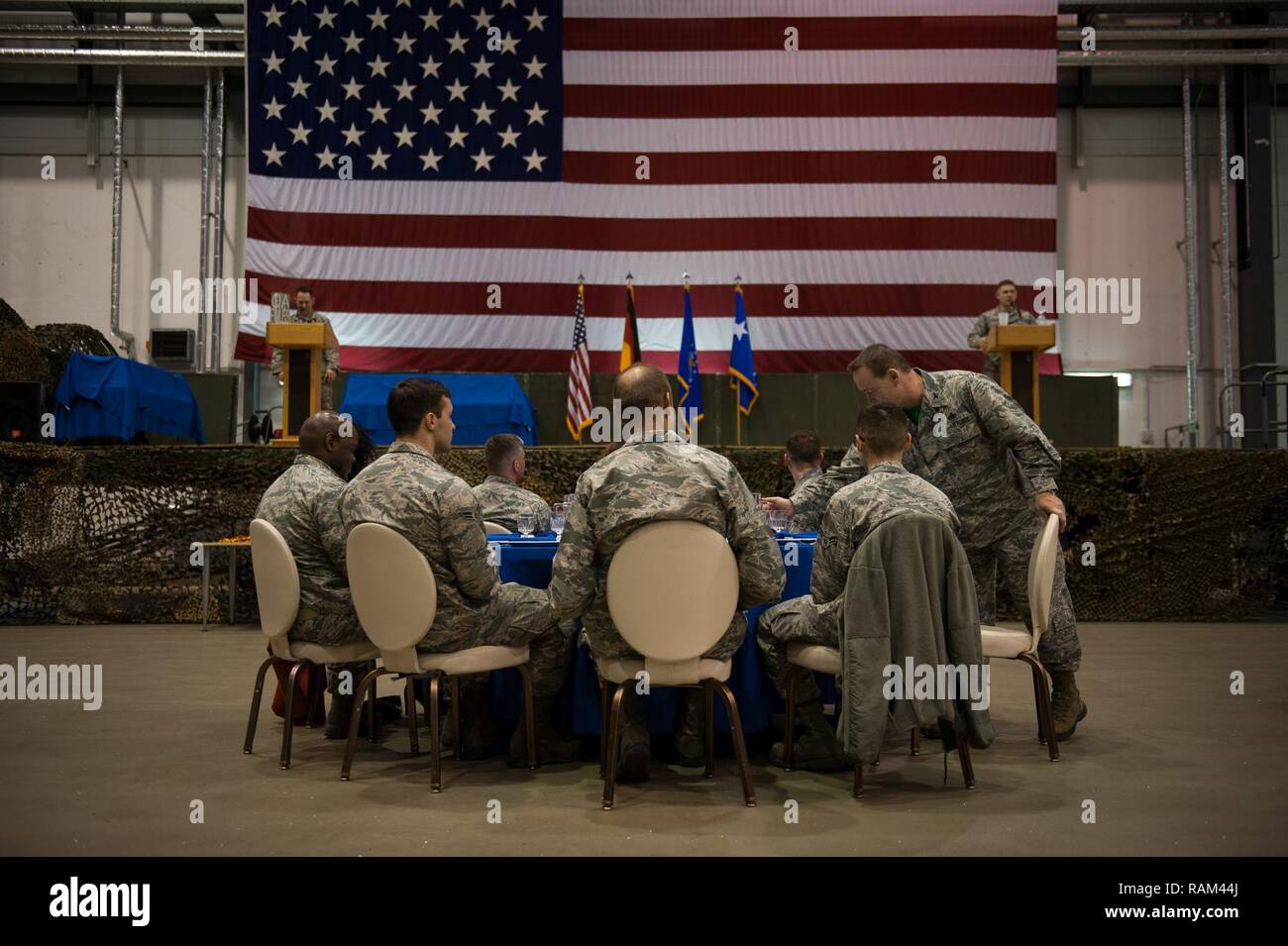 Airmen sit down at a table around Lt. Gen. John B. Cooper, headquarters ...