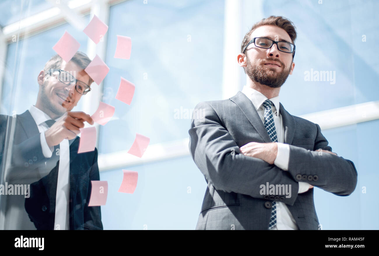 successful Manager standing in a modern office Stock Photo - Alamy