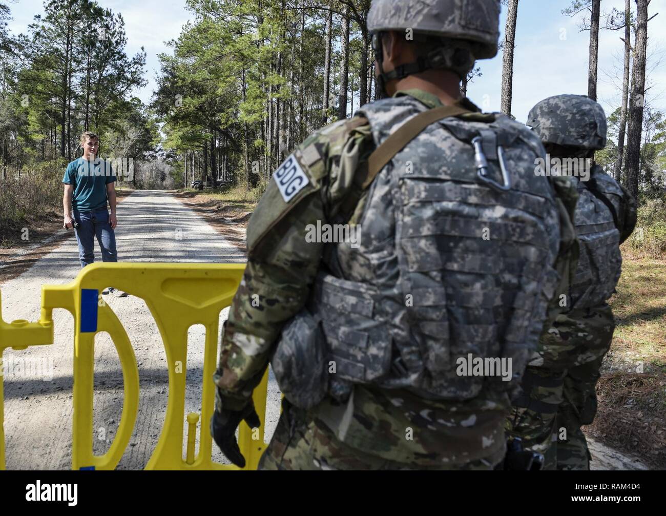 Airmen from the 822nd Base Defense Squadron simulate questioning a resident of a neighboring ...