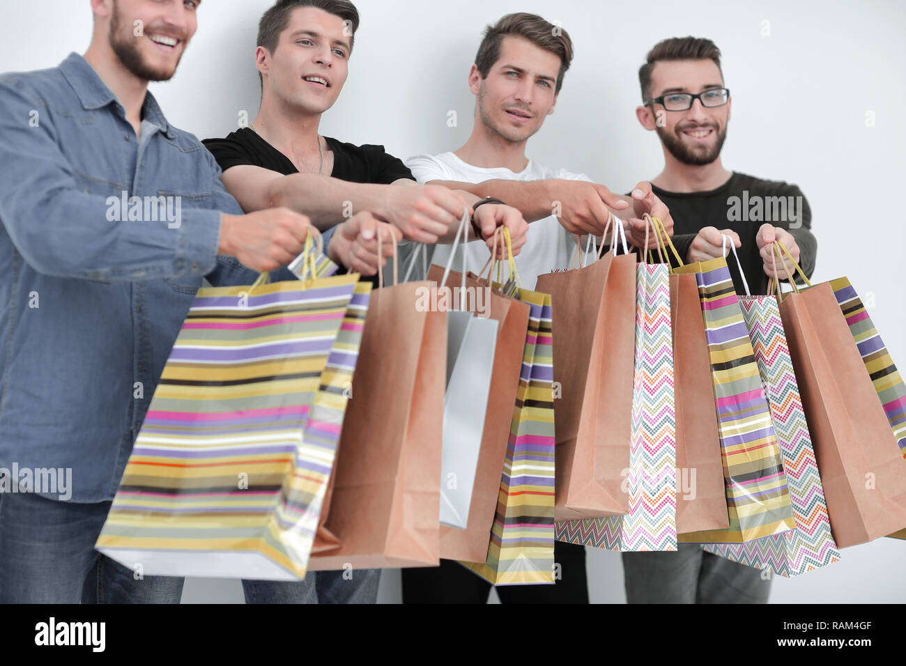 paper bags in the hands of a team of friends Stock Photo - Alamy