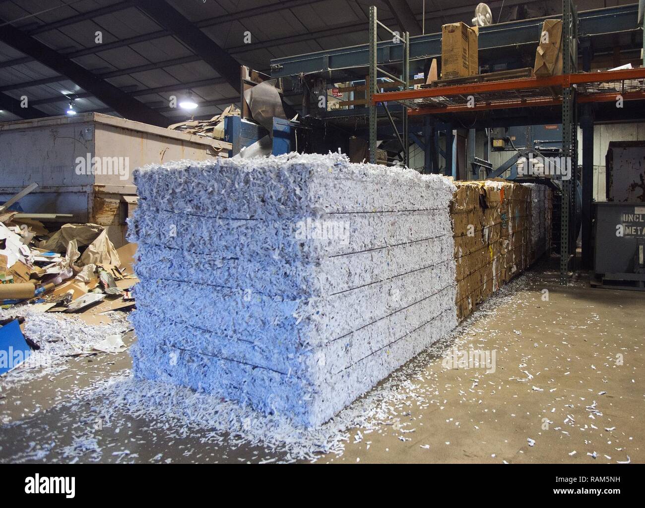 Recently compressed bales of shredded paper, cardboard and other ...