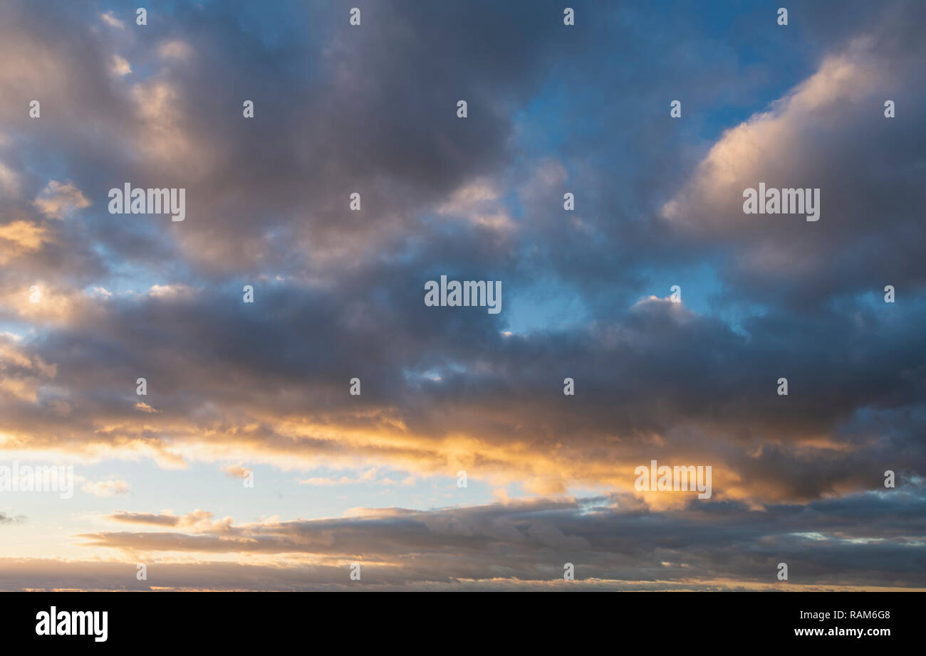 Beautiful colorful golden hour sunset sky with cloud formation and ...