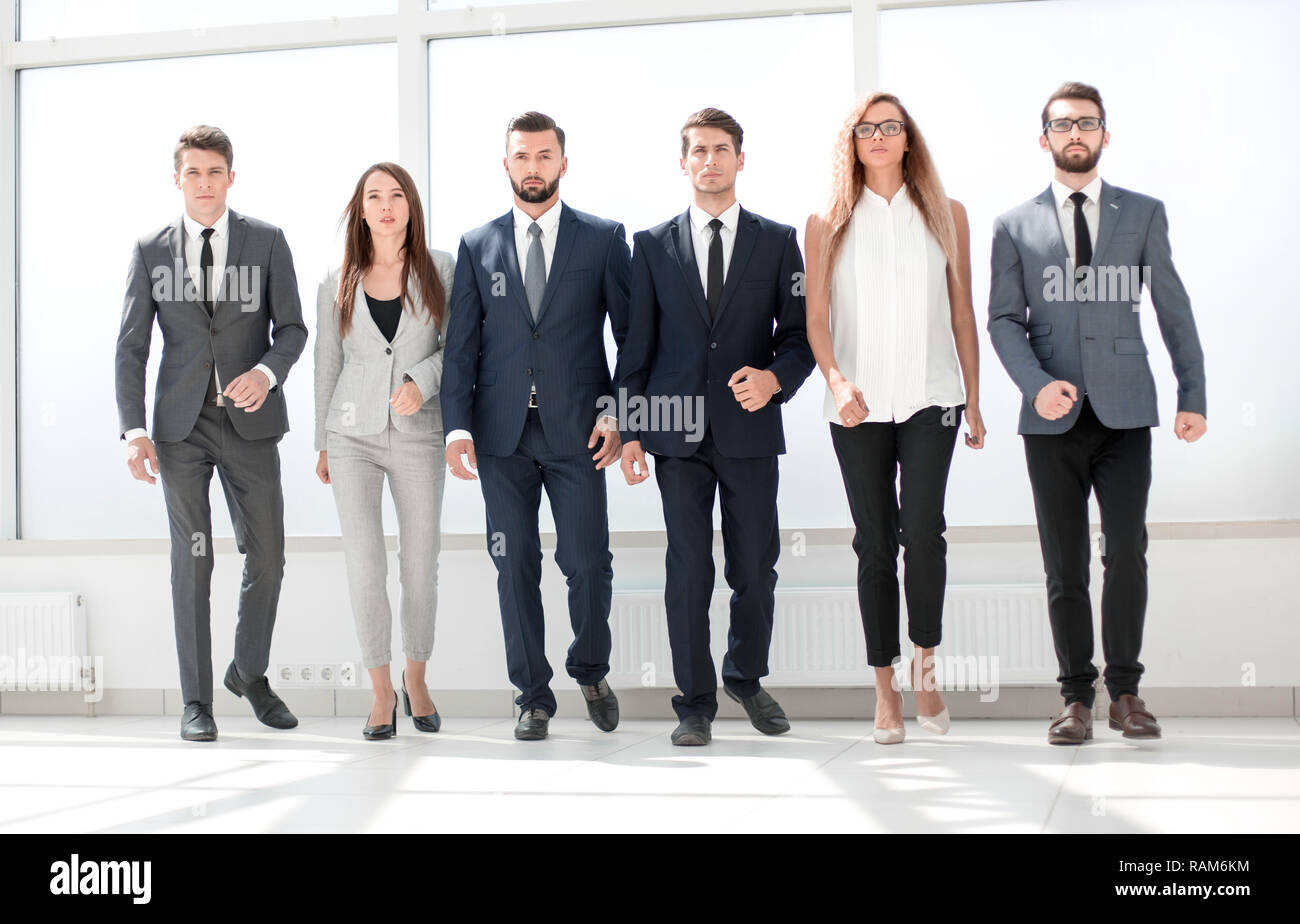 confident business team stepping forward Stock Photo - Alamy