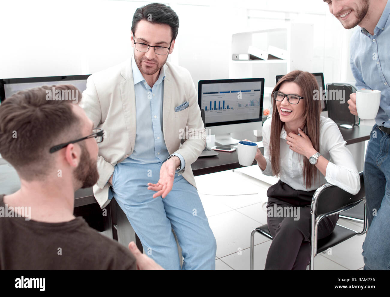 business team discussing news during coffee break Stock Photo - Alamy
