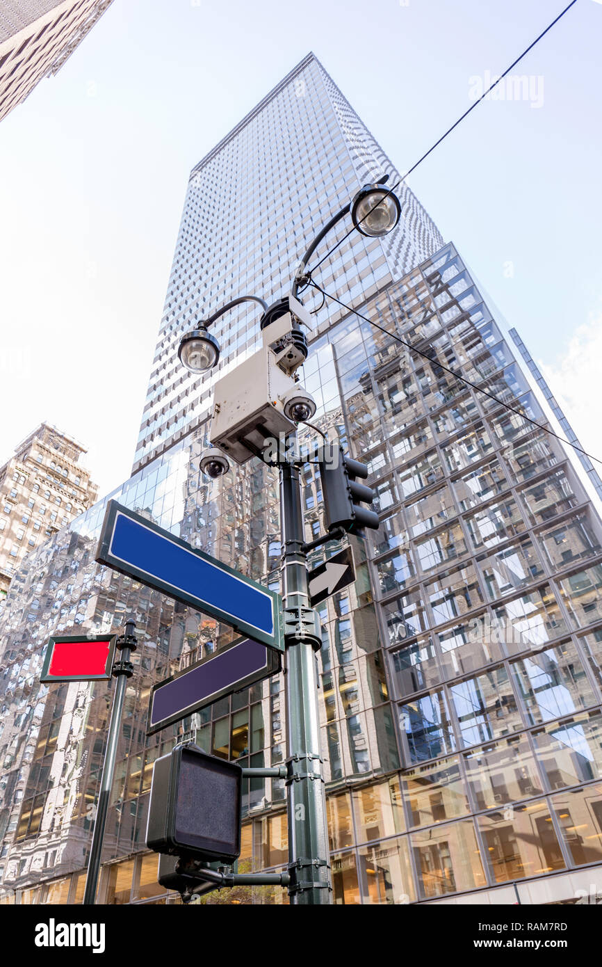 low angle view of skyscrapers and road signs on street, new york, usa ...