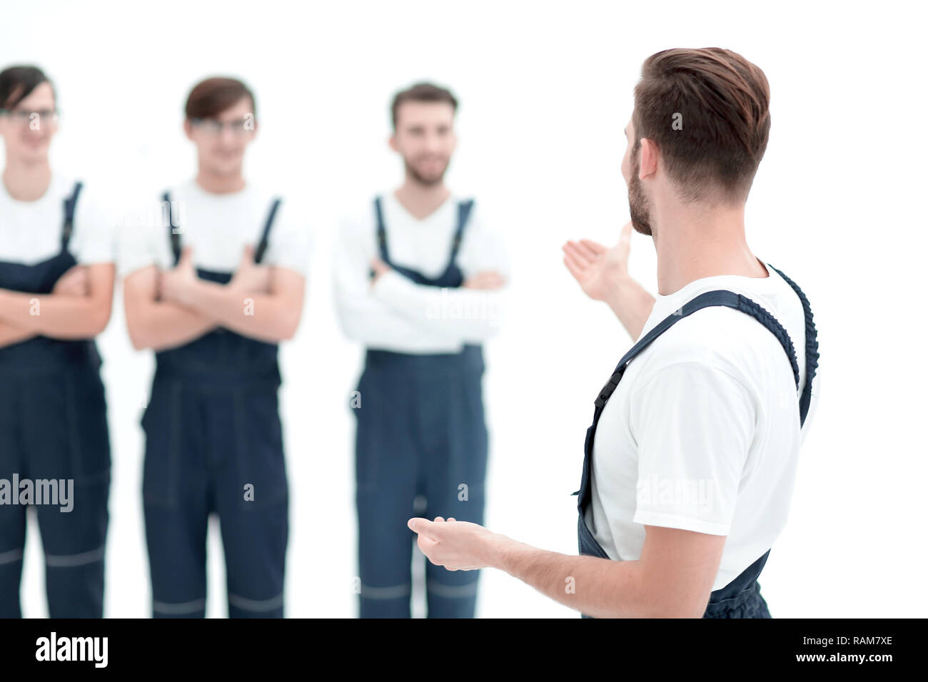 cheerful team of responsible movers and their smiling leader Stock ...