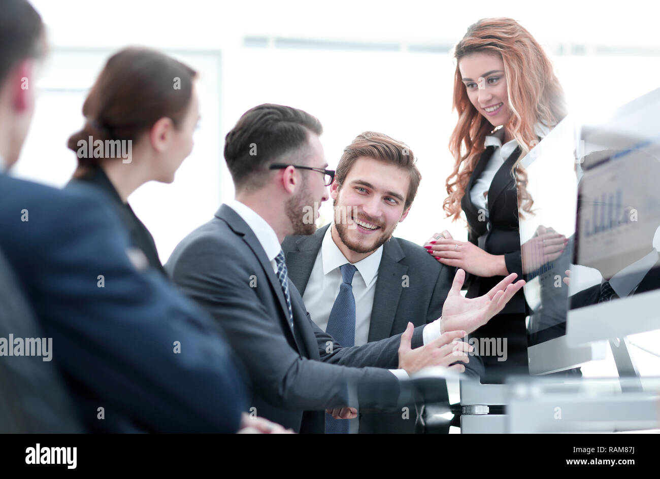 employees discussing financial charts Stock Photo - Alamy