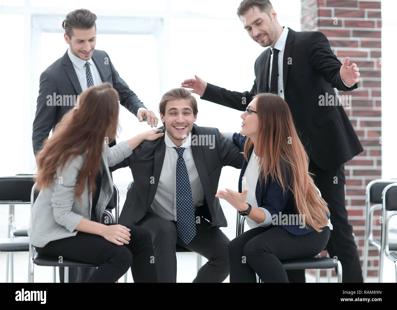 Hugging business people toasting to celebrate success Stock Photo - Alamy