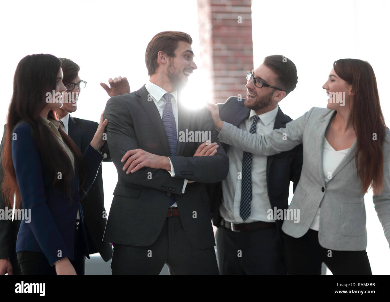 Portrait of an enthusiastic business team congratulating their c Stock ...