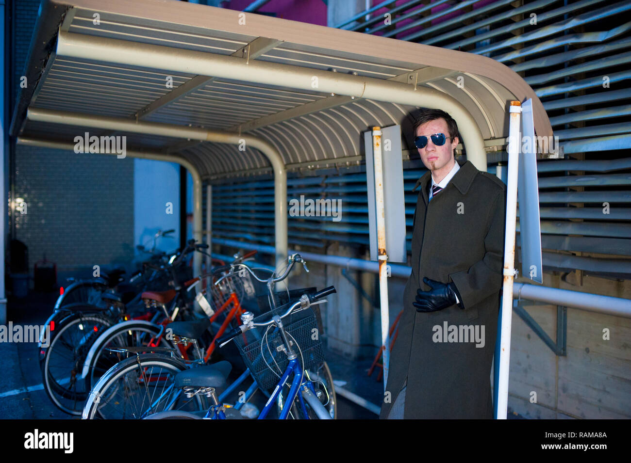 Caucasian male model poses for pictures on the street Stock Photo - Alamy