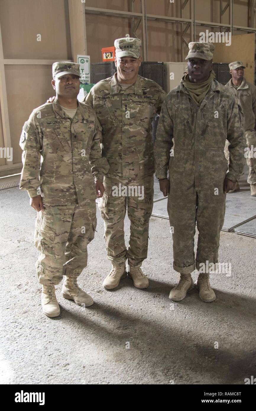 Lt. Gen. Michael X. Garrett (center), the U.S. Army Central Commander ...