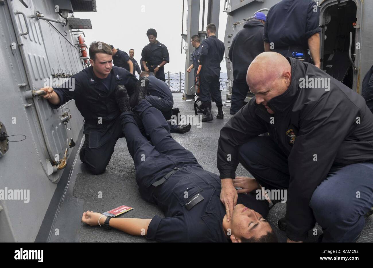 PACIFIC OCEAN (Feb. 16, 2017) Quartermaster 3rd Class Halen Magee (left ...