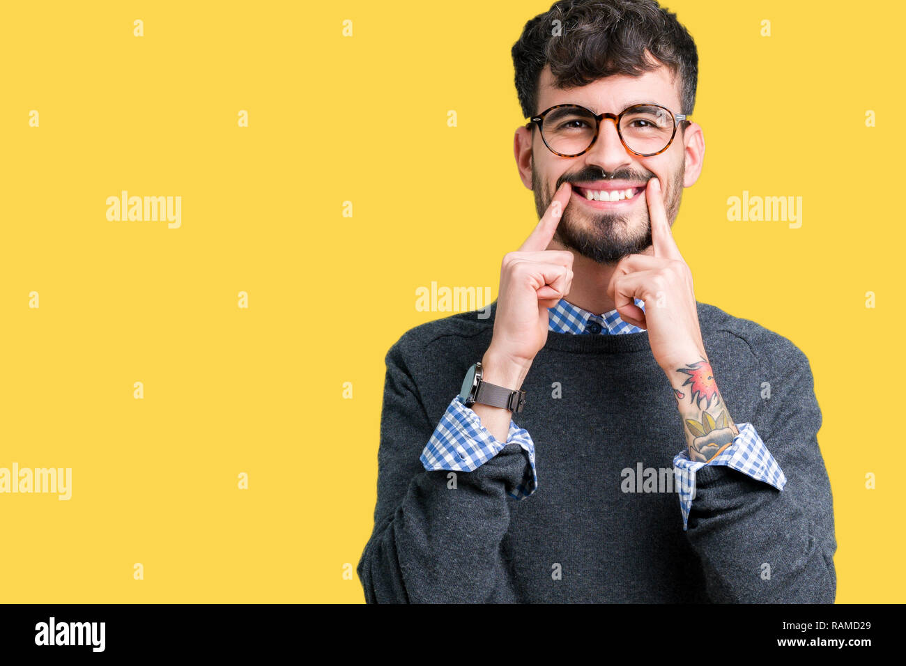 Young handsome smart man wearing glasses over isolated background ...