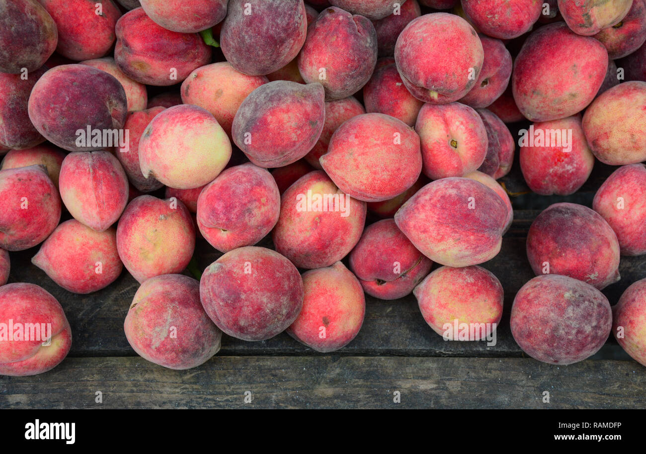 Red peach fruit on wooden table in Sapa, North of Vietnam Stock Photo ...