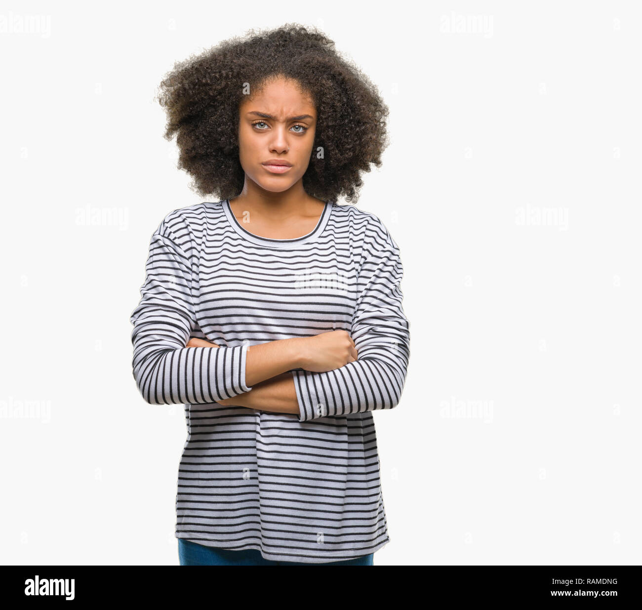 Young afro american woman over isolated background skeptic and nervous ...