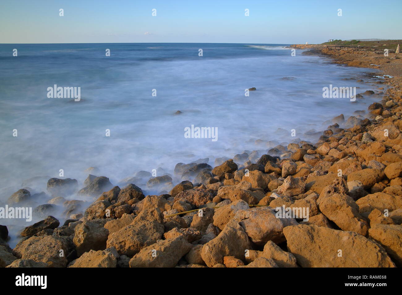 Oneiric landscape with Mediterranean Sea bay and stony beach in Paphos ...