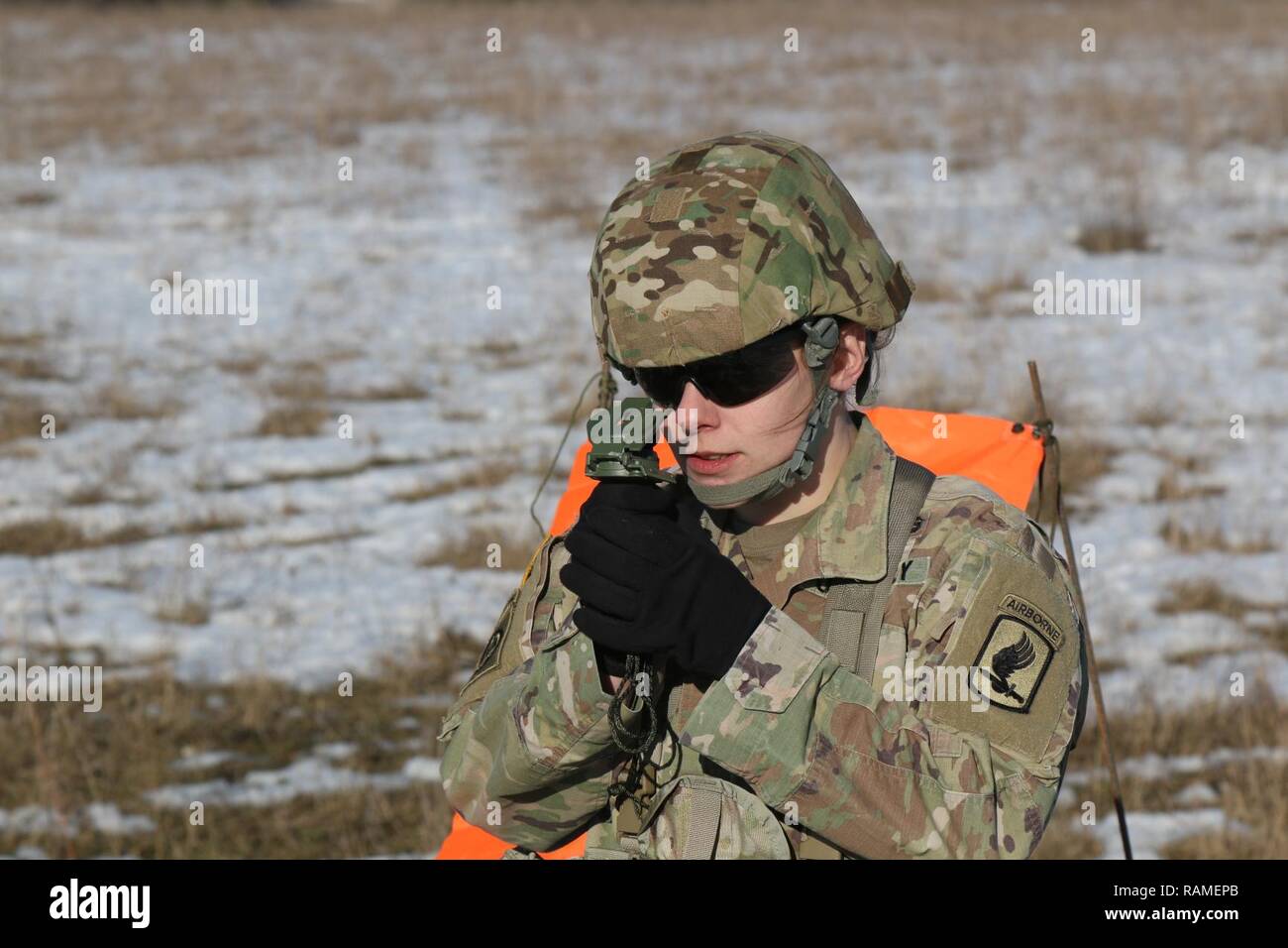 A Soldier, assigned to 173rd Airborne, shoots an azimuth as she ...