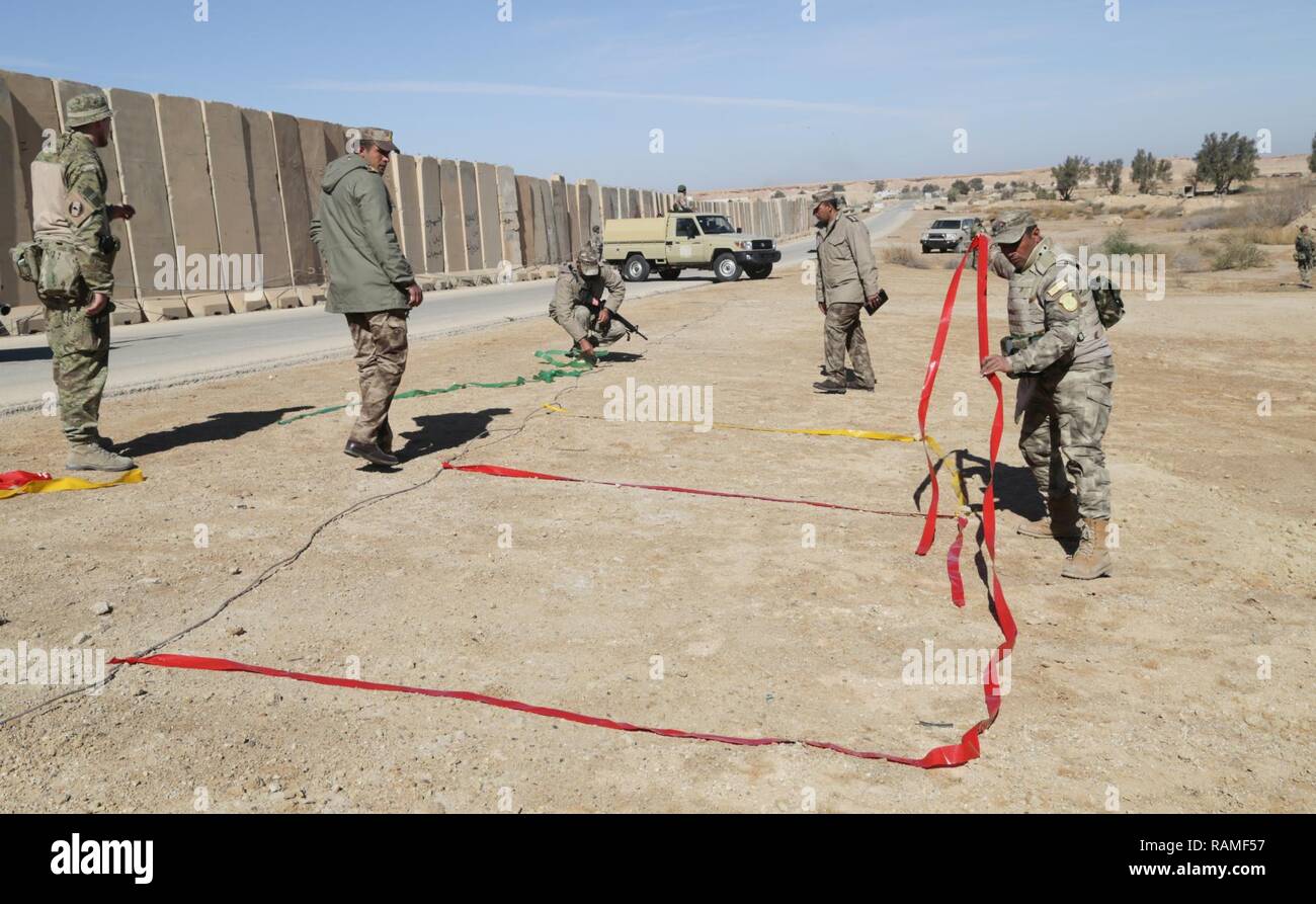 Iraqi security forces soldiers set up a perimeter to conduct search and ...
