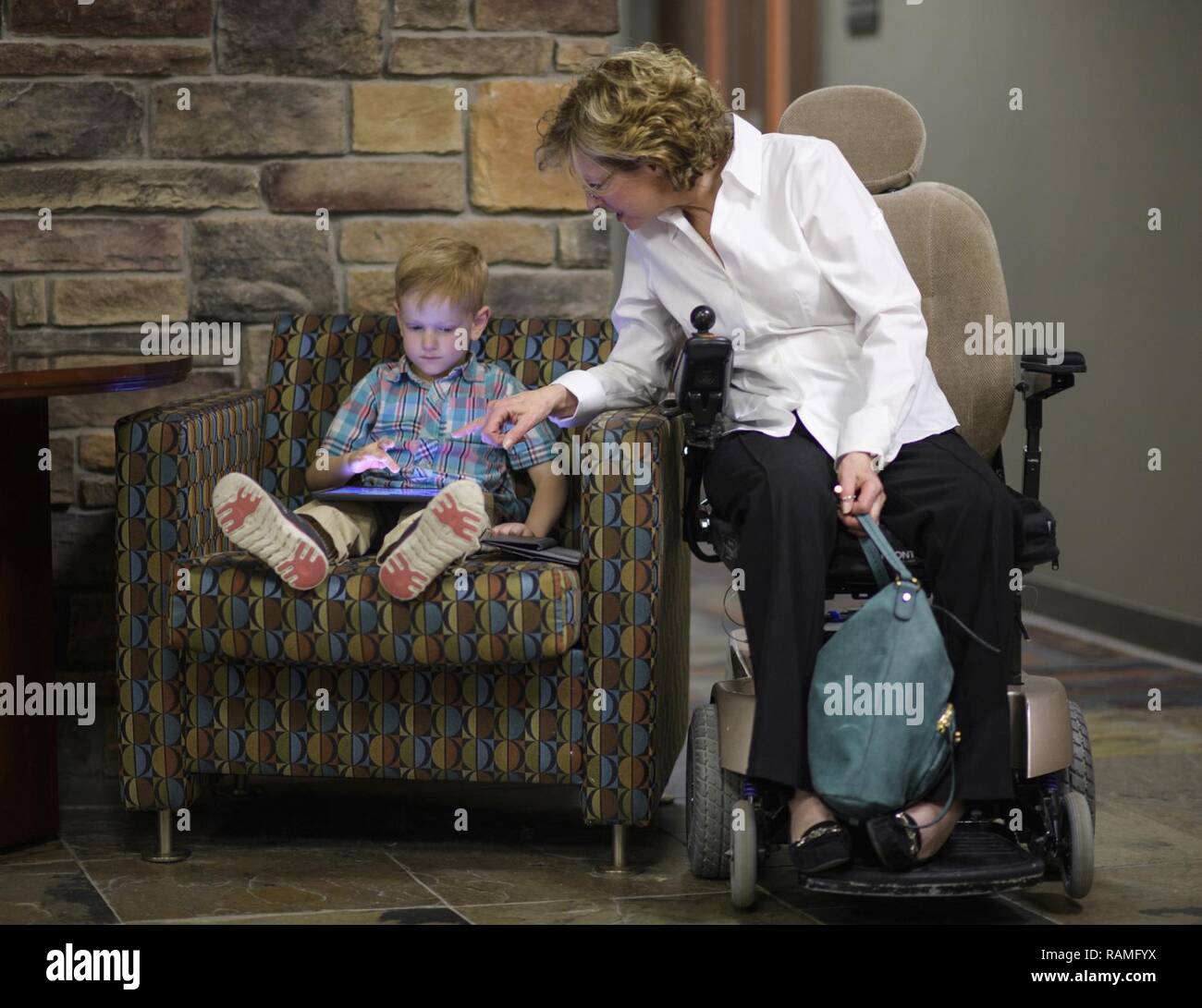 Tracey Kimball, wife of Chief Master Sgt. Tom Kimball, plays with ...