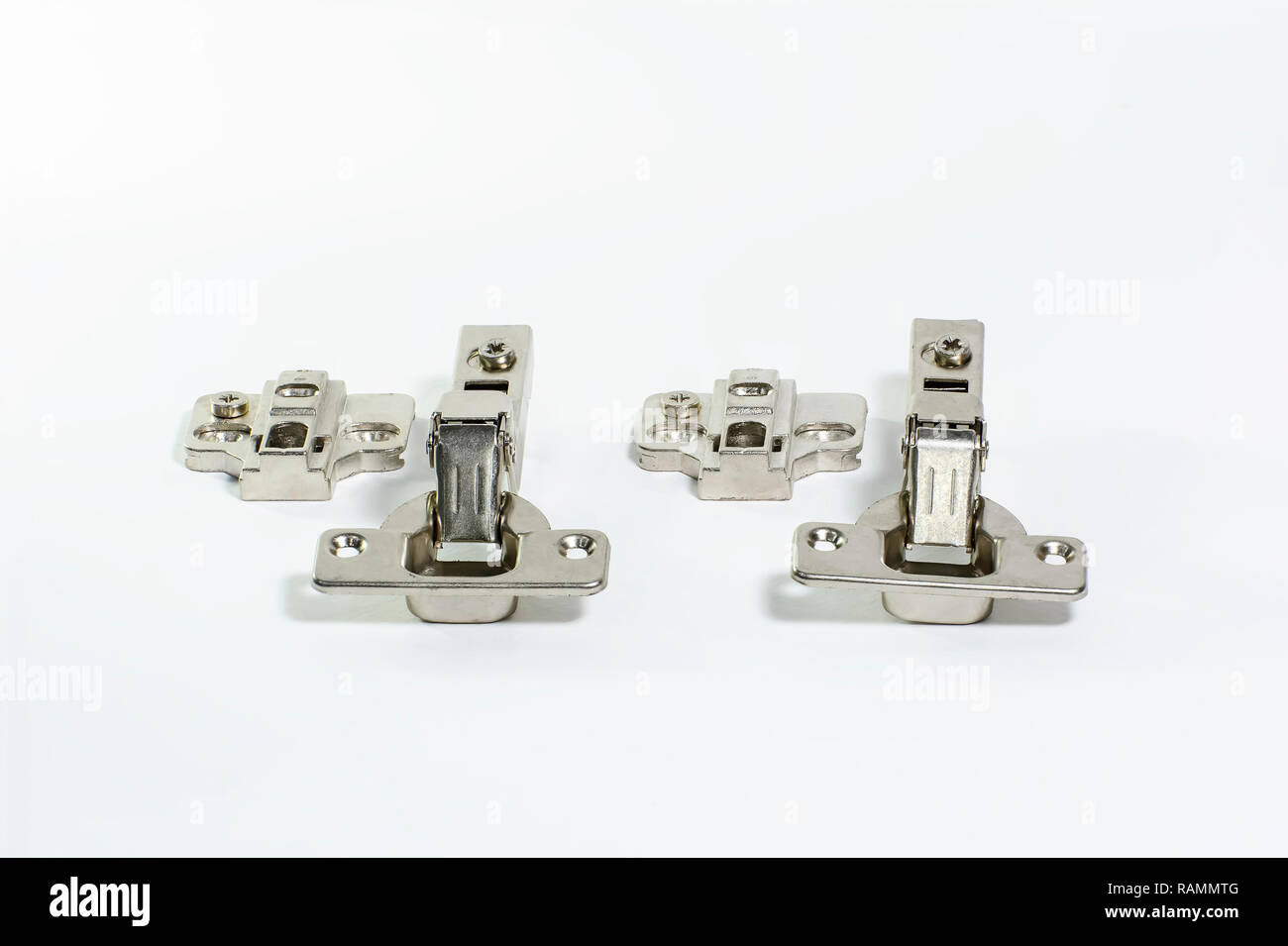 Metallic hinge systems isolated on white background Stock Photo - Alamy