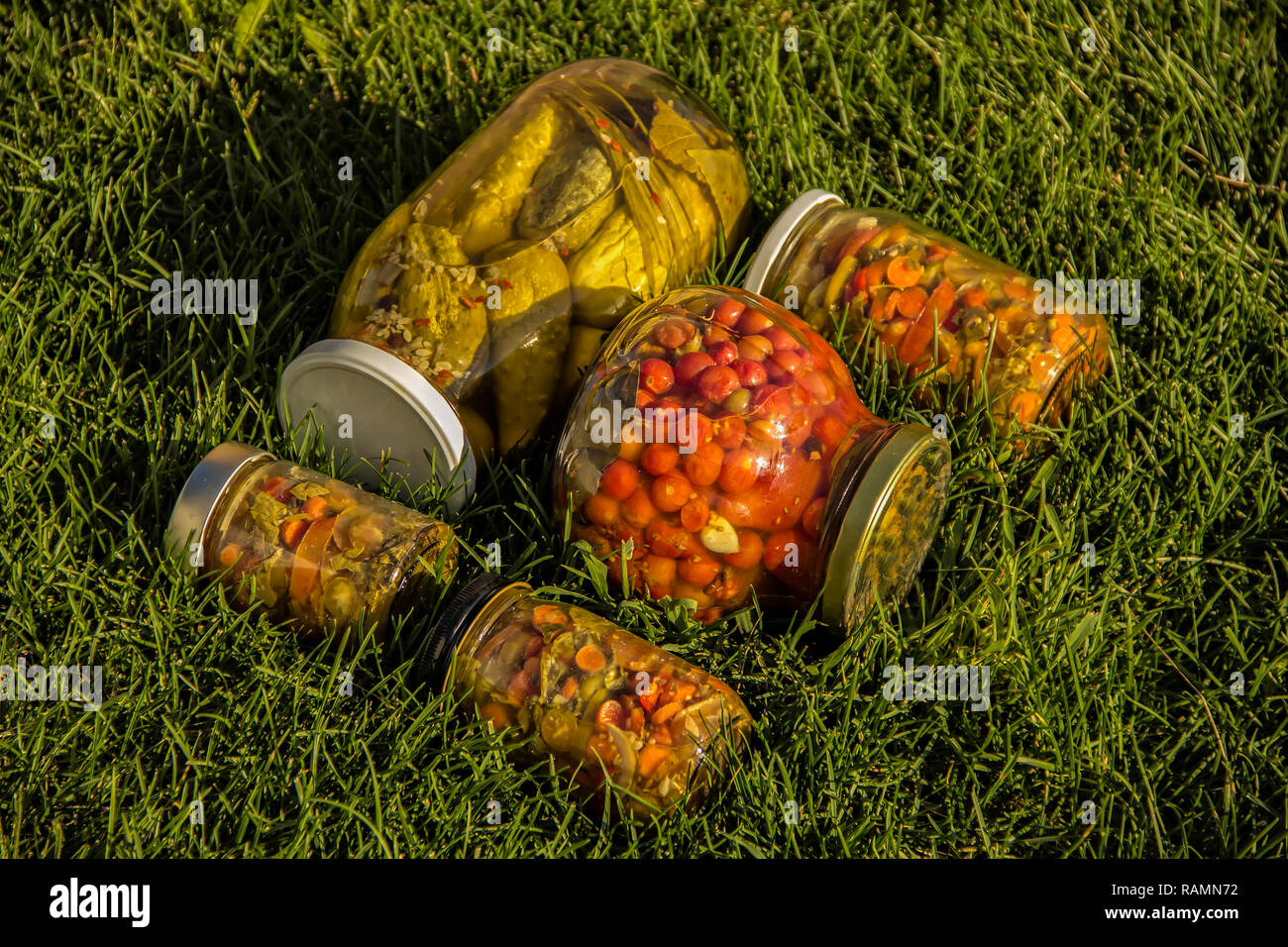 Marinated food. Assortment autumn preserves. Jars of pickled vegetables ...