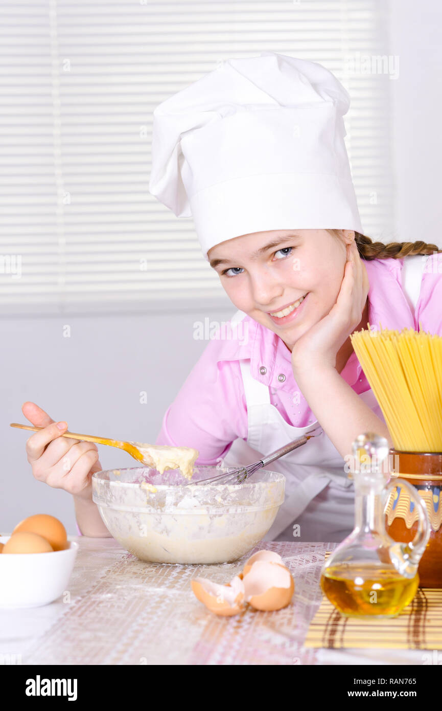 Cute girl cooking in the kitchen at home Stock Photo - Alamy