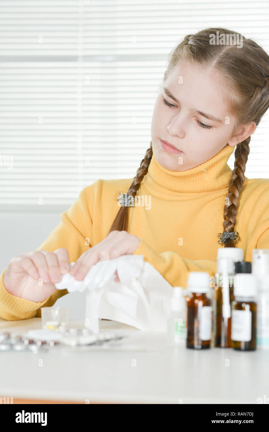 Portrait of ill girl taking medicine at home Stock Photo - Alamy