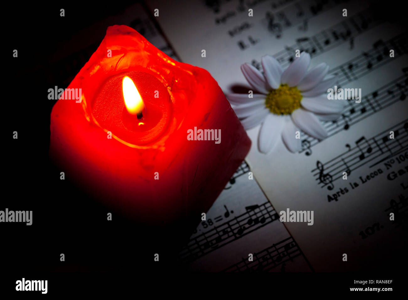 Flower Daisy Music Notes Sheets and Candle Light Stock Photo - Alamy