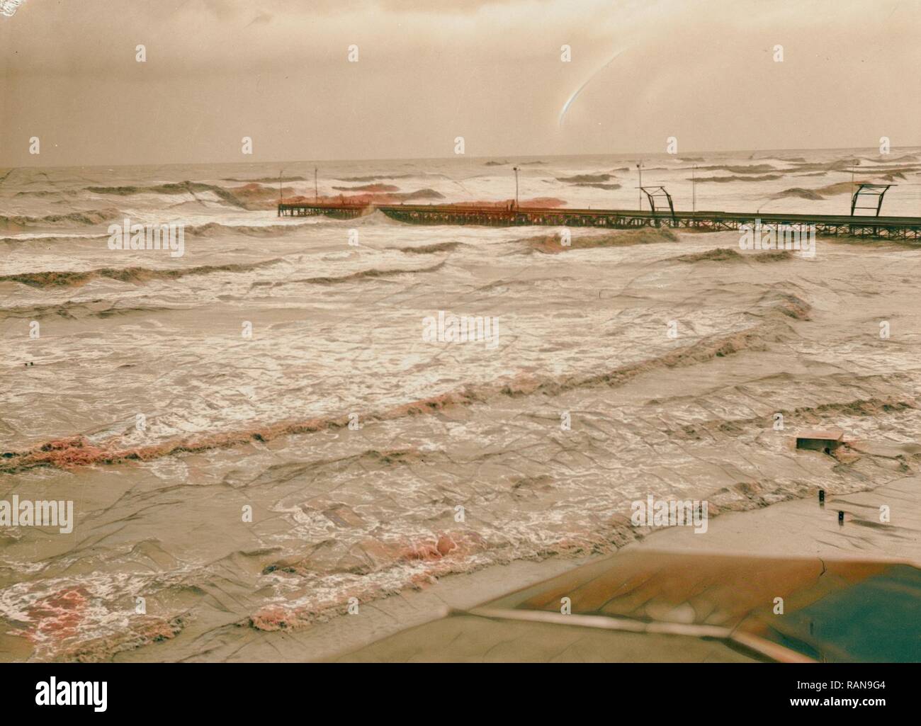 Official opening of Tel Aviv. The Tel Aviv jetty in storm. Distant view ...