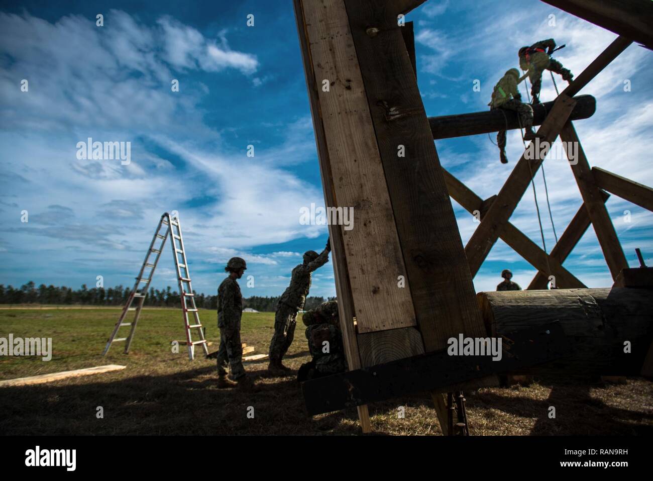 Sailors from Naval Mobile Construction Battalion (NCB) 133 work ...