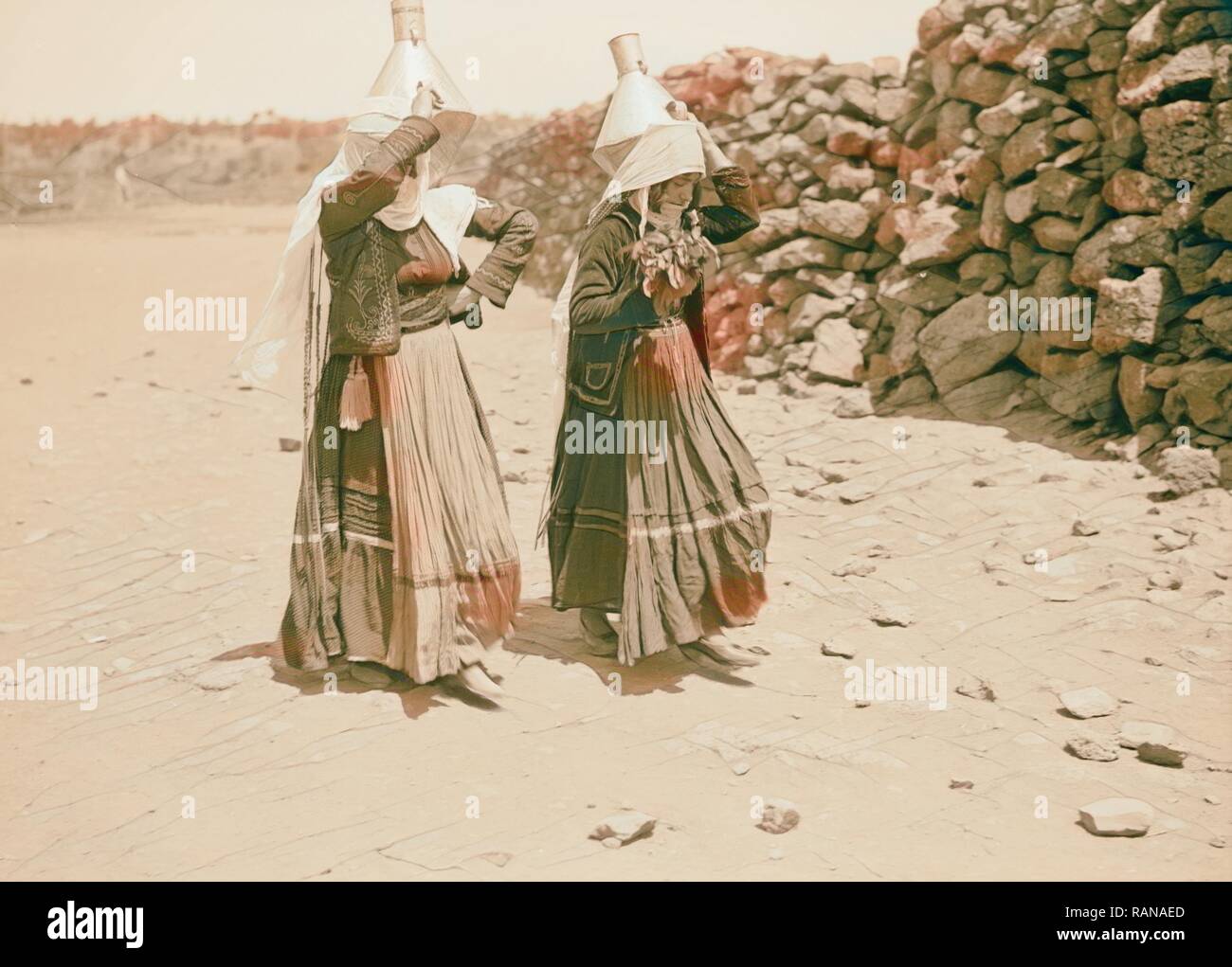 Jebel el-Druze & Hauran. Ghureye. Two Druze women with water cans ...