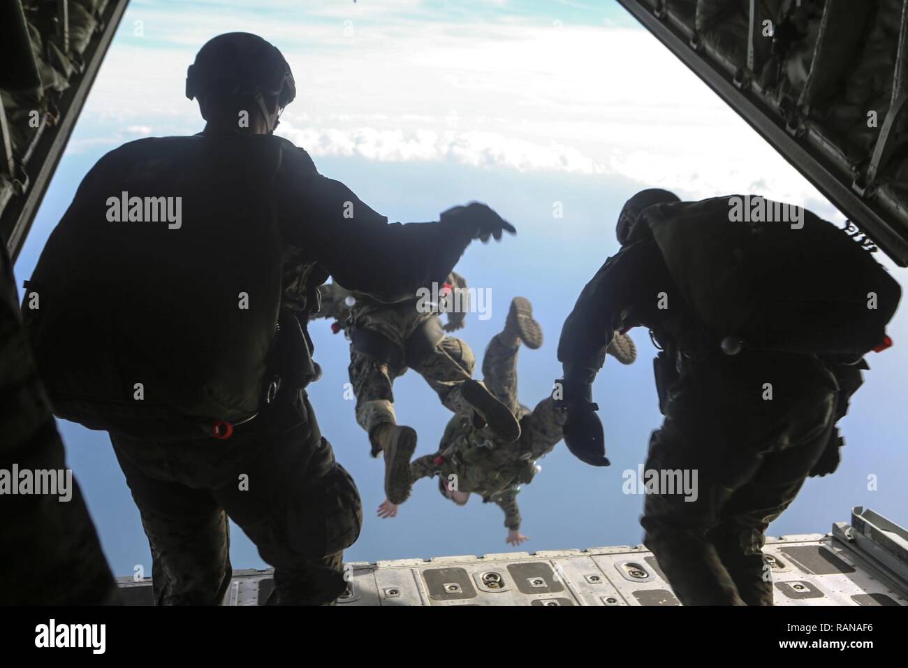 Marines dive from the back of a Lockheed C-130 Hercules at Marine Corps ...