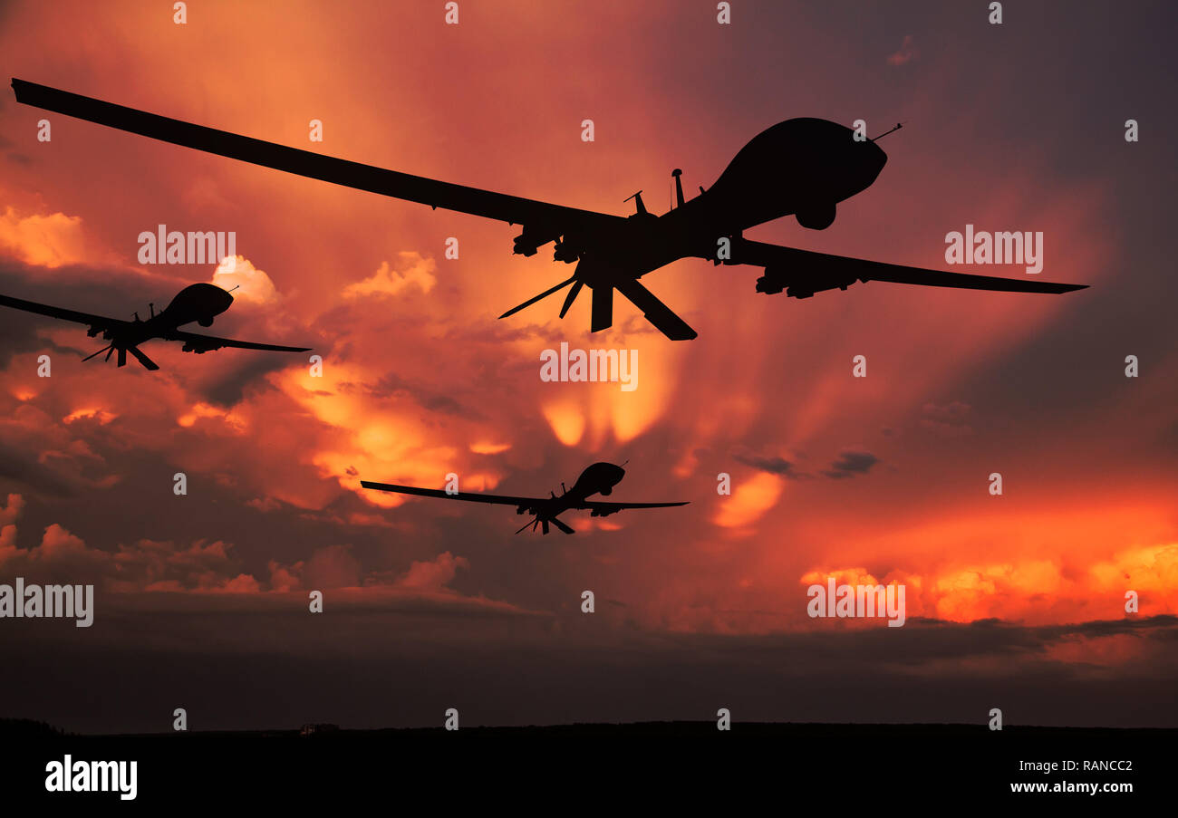 Drones swarm on sunset background Stock Photo - Alamy