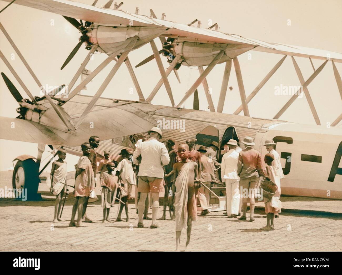 Sudan. Malakal. Passengers entering the plane southward bound. 1936 ...