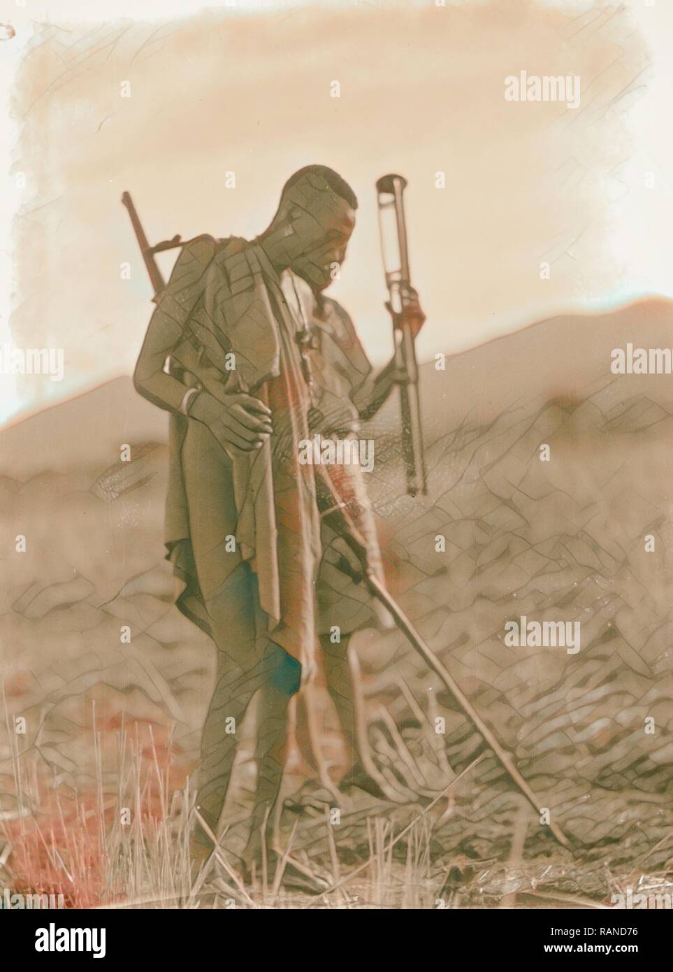 Kenya Colony. Namanga, southern game reserve. Native tracker studying ...