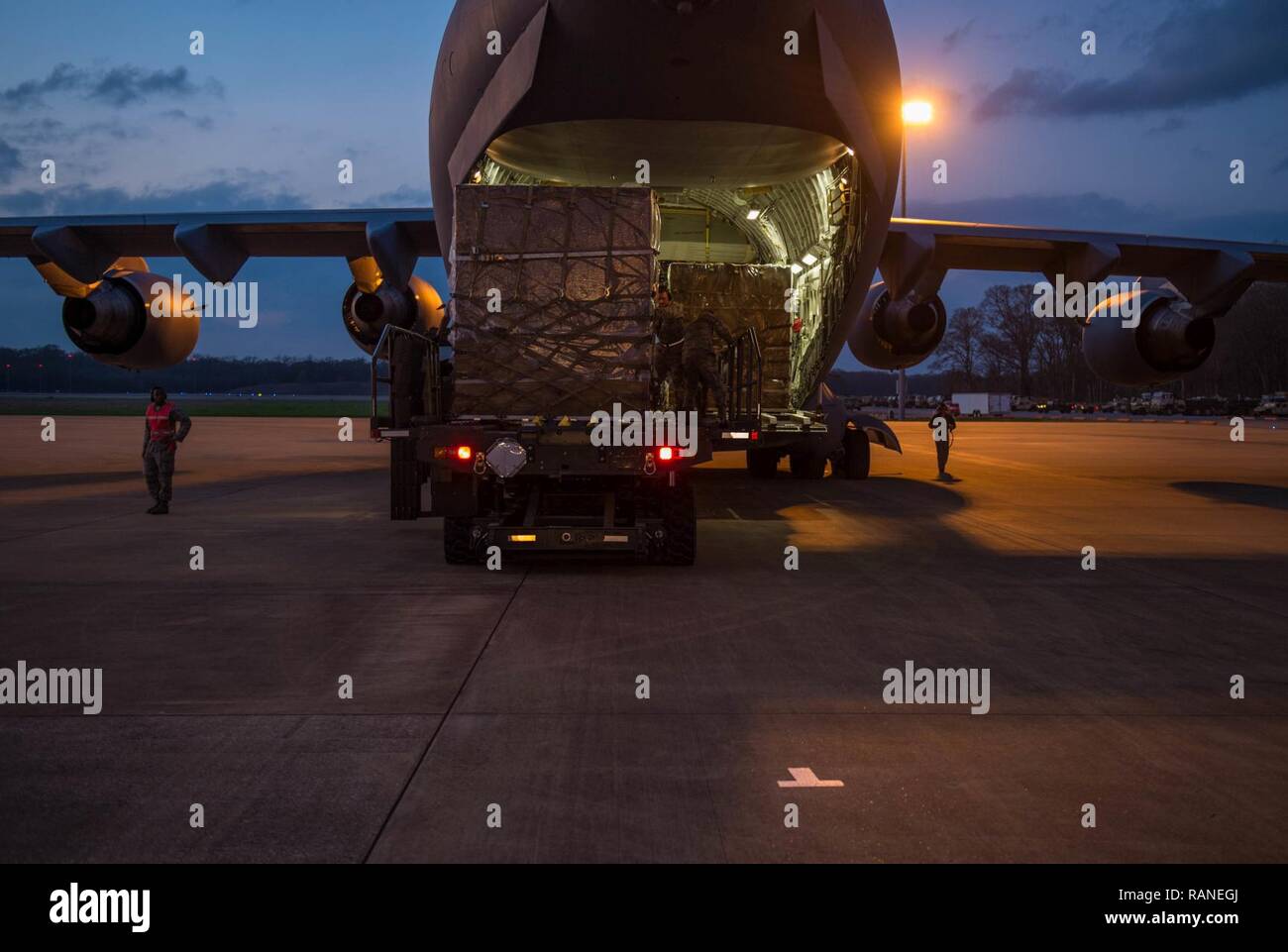 Airmen from the 621st Contingency Response Wing, offload cargo from a C ...