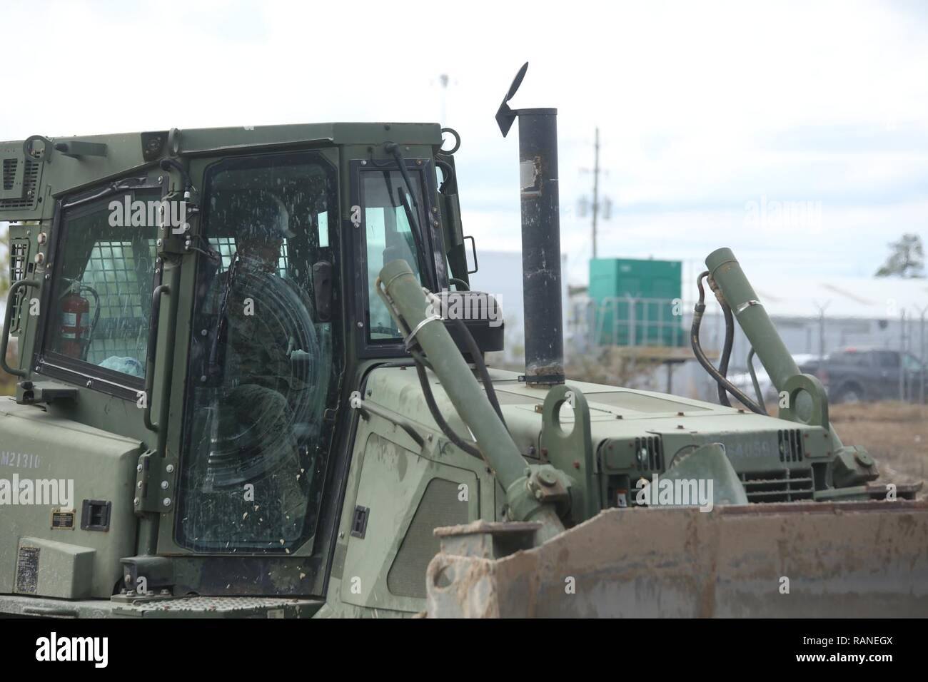 A Marine with Combat Logistics Battalion 22 operates a bulldozer during ...