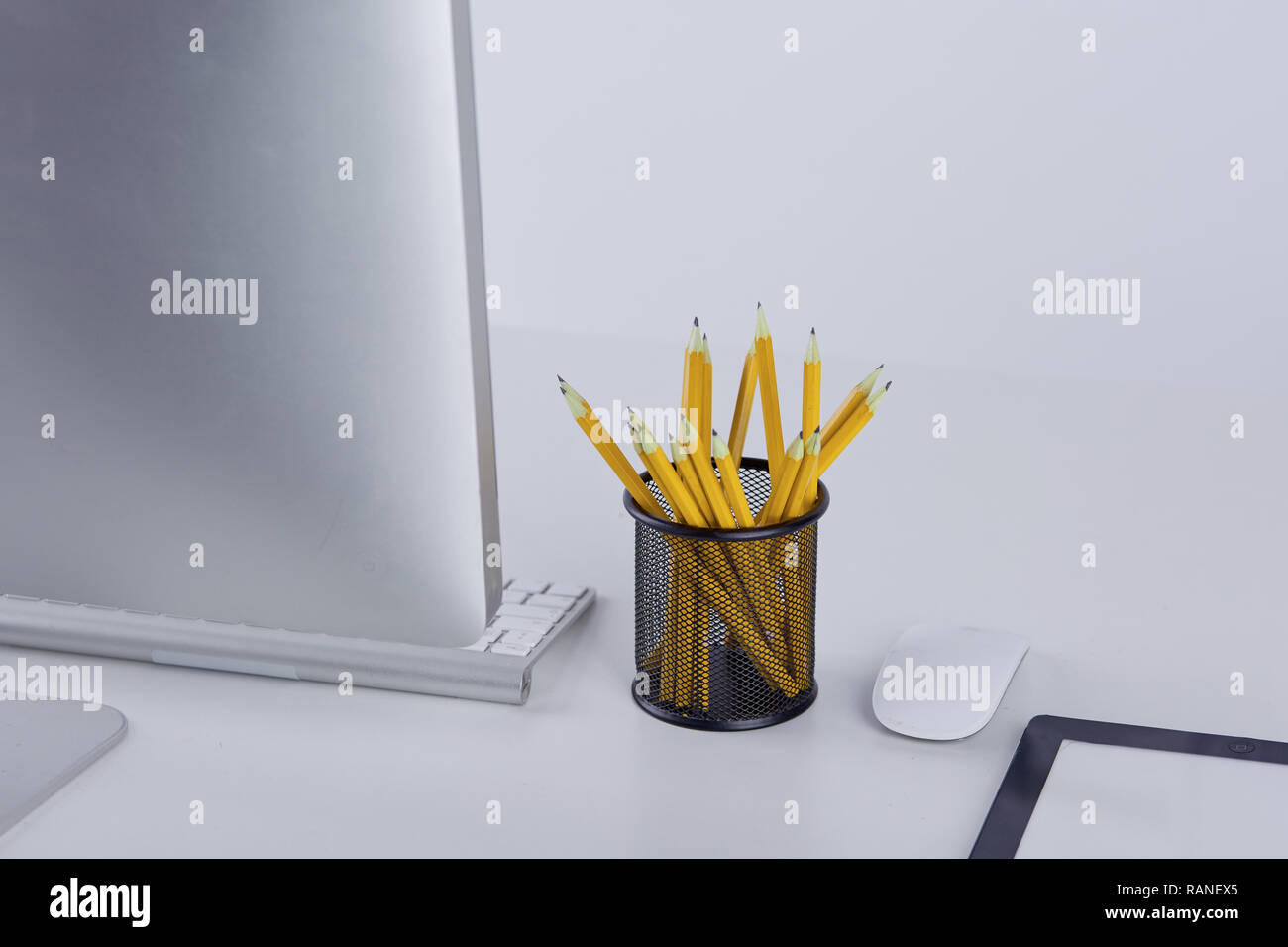 Graphite pencils in a metal grid-container. Concept Stock Photo - Alamy